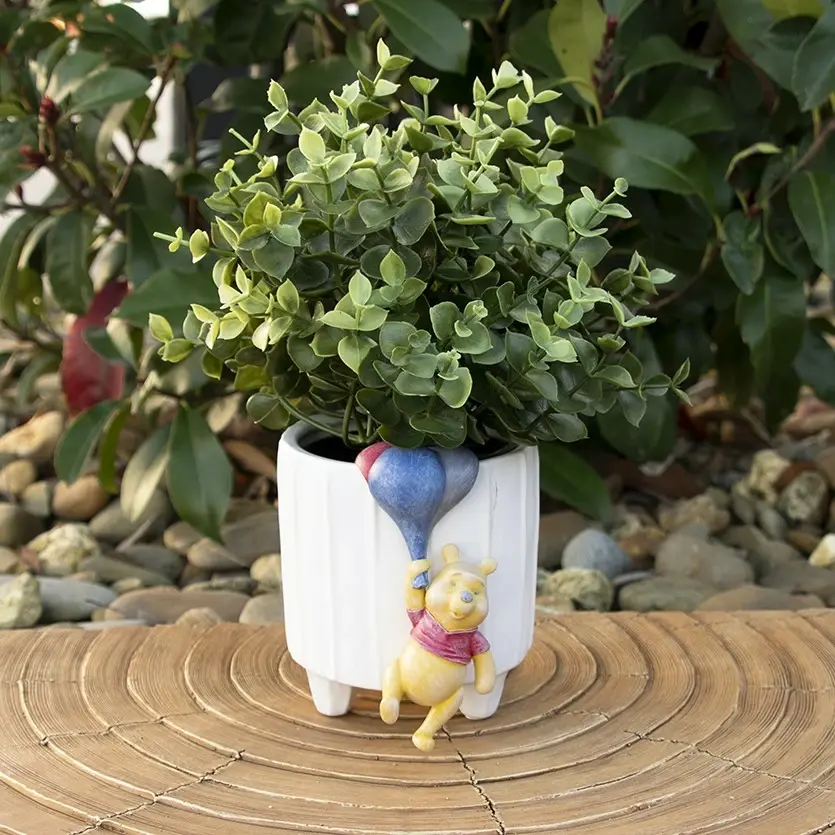 Winnie The Pooh & Balloon Pot Buddy - Cowell's Garden Centre | Woolsington